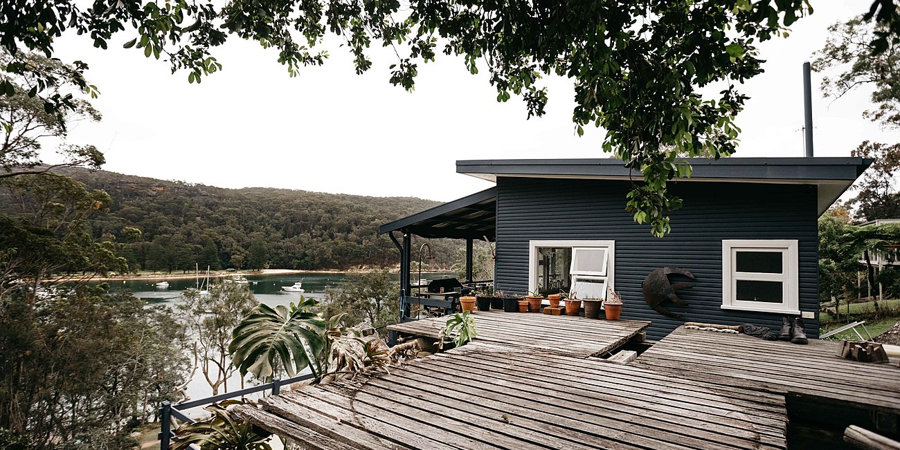 The Retreat at Coasters - A house on some rocks in the trees. With a ...