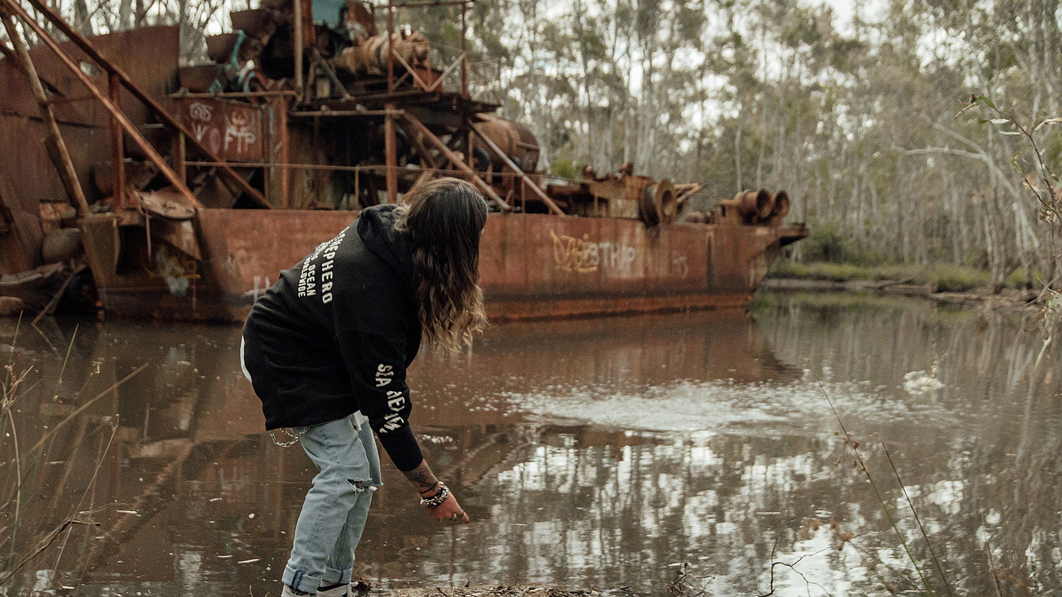 Old Dredge and dragline sitting in the water | Riparide