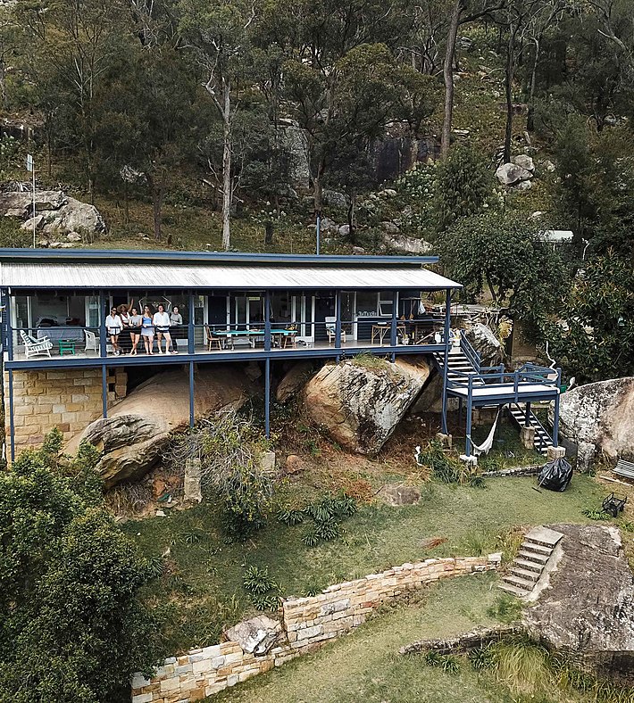 The Retreat at Coasters - A house on some rocks in the trees. With a ...