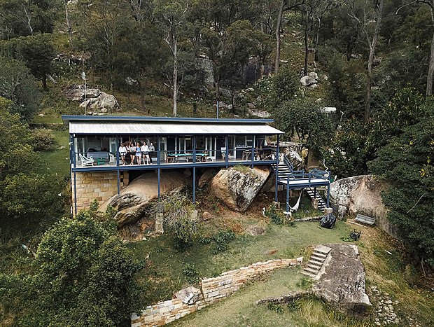 The Retreat at Coasters - A house on some rocks in the trees. With a ...